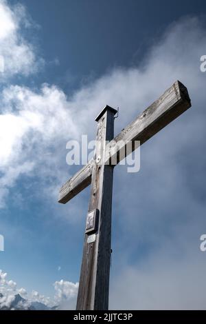 A low angle shot of a wooden cross under the clouds Stock Photo - Alamy