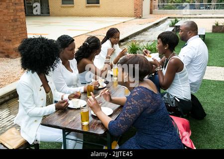 A group of young African students socialising on campus in Johannesburg ...