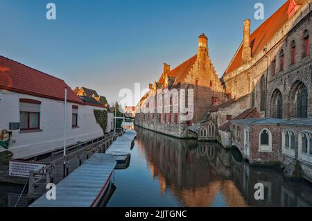An aerial view of cityscape Bruges surrounded by buildings Stock Photo ...