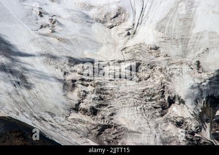 A mesmerizing winter landscape with snow-covered trees reflected in a ...