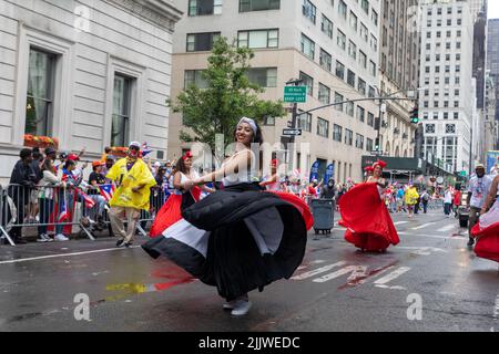 Excited female traditional dancers at the Puerto Rican Day Parade in ...