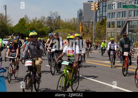 A closeup shot of bikers participating in the Five Boro Bike tour in ...