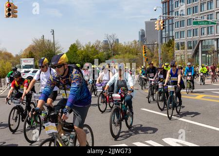 A closeup shot of bikers participating in the Five Boro Bike tour in ...