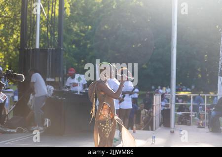A closeup shot of a singer at the 13th Annual Juneteenth celebration in ...