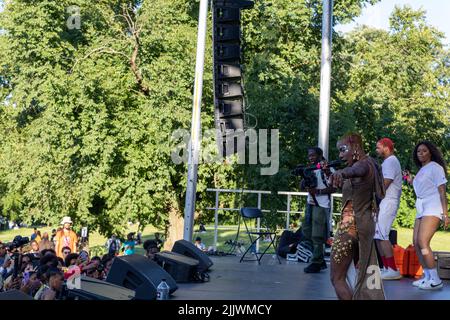 A closeup shot of a singer at the 13th Annual Juneteenth celebration in ...