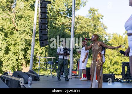 A closeup shot of a singer at the 13th Annual Juneteenth celebration in ...