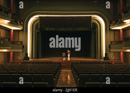 Ballerina bowing on stage in theater Stock Photo - Alamy