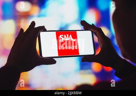 In this photo illustration, the Saia, Inc. logo is displayed on a ...