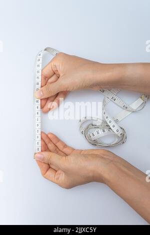 Tape measure to measure various body parts Stock Photo - Alamy