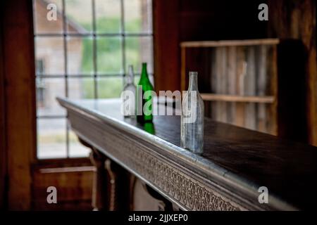Inside a Saloon bar in an old western town the barkeep is going to hit ...