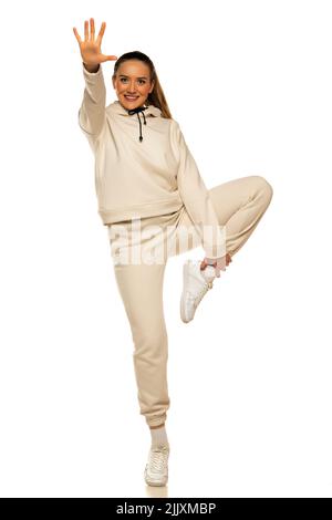 Young happy woman teacher coach standing at desk in classroom office ...