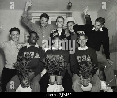 American athlete Jesse Owens, left, breaks the tape in a record time of ...