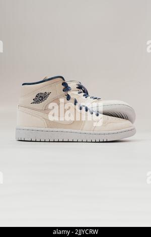 A vertical shot of bright Nike Air Jordan 1 high OG sneakers Stock ...