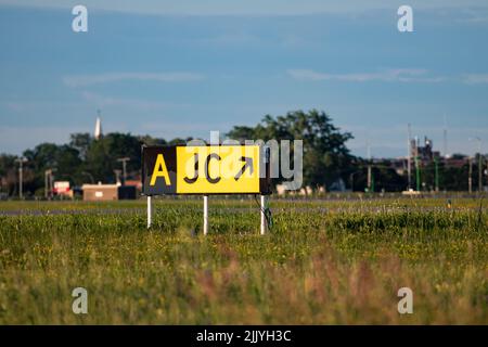 Airport taxiway sign. Sign markings on taxiway for direction at airport ...