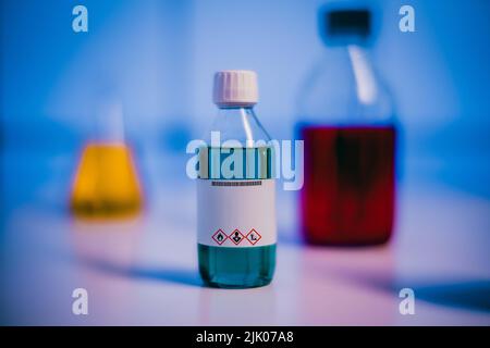 chemical solution glass bottles warning with hazard signs Stock Photo ...