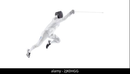 Dynamic portrait of young man, fencer in in fencing costume with sword ...