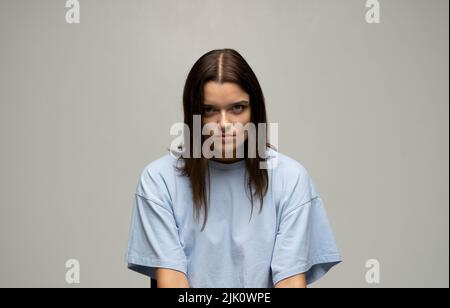 Negative human emotions and feelings. Grumpy angry young woman posing ...
