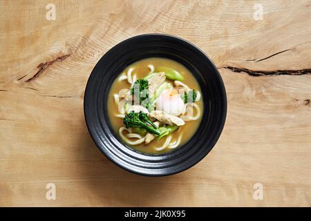 Ramen with udon noodles, chicken, broccoli and spring onion Stock Photo ...