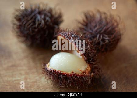 Inside view of an tropical rambutan fruit on white background Stock ...