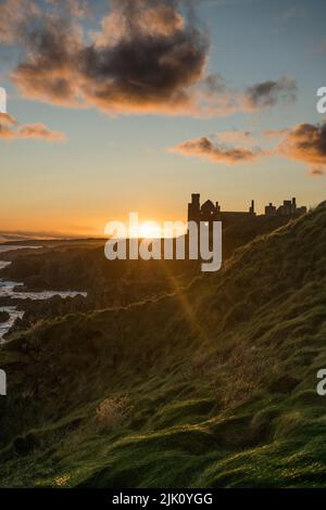 The ruins of the 16th century Slains Castle, perched high on the cliffs ...