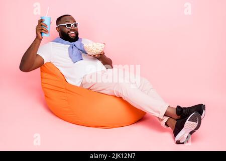Full size photo of cheery young man shopaholic show black friday ...