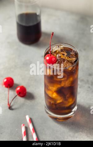 Cold Refreshing Cherry Cola Soda with a Straw Stock Photo - Alamy
