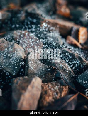 Vertical shot of cracked wet rocks and a steam coming out of them Stock ...