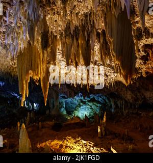 Stalagtite cave with multiple colors and holes in the rock Stock Photo ...