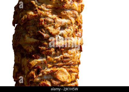 A chicken shawarma skewer roasting on a rotating pole Stock Photo - Alamy