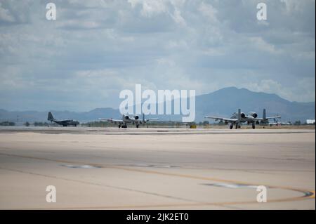 Two U.S. Air Force EC-130H Compass Calls sit on the flight line at ...