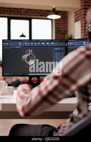 African american engineer prototyping gears model on manufacturing ...