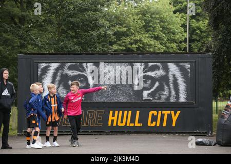 Some young Hull City fans playing outside the stadium Stock Photo - Alamy