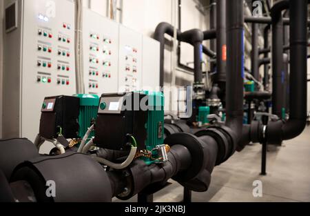 Cooling system of a supercomputer. Pipes with electrical motors Stock ...