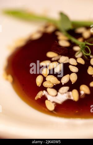 Porcelain dish with sesame seeds Stock Photo - Alamy