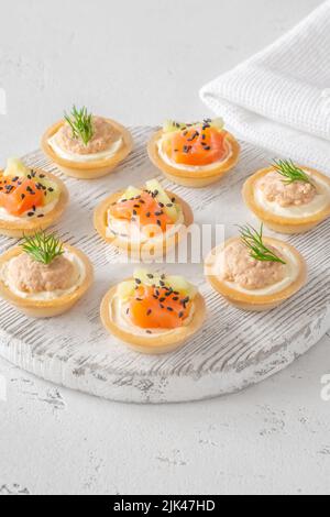 Canapes with cream cheese, cod roe and salmon Stock Photo - Alamy