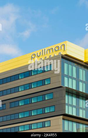 Pullman Hotels lettering on top of a hotel building. Logo of a famous ...