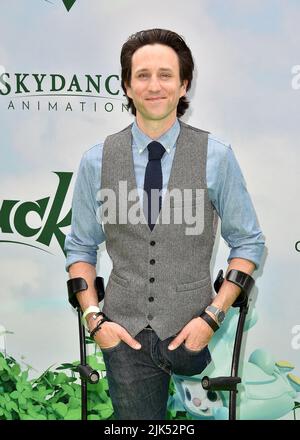 Josh Sundquist walking on the red carpet at the global premiere of the ...