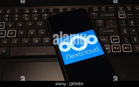 nextcloud logo on mobile phone , background is a keyboard , Sydney ...