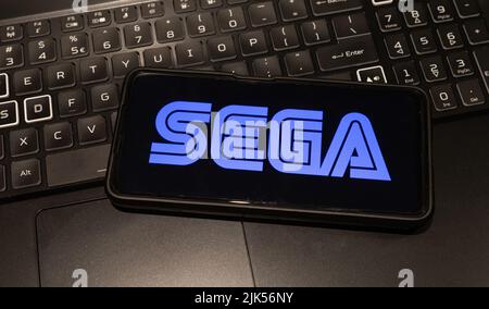 sega logo on mobile phone , background is a keyboard , Sydney Australia ...