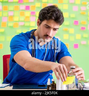 Young doctor with many reminders and urgent work Stock Photo - Alamy