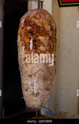 Close up shot of stacked meat roasting to be used in preparation of ...