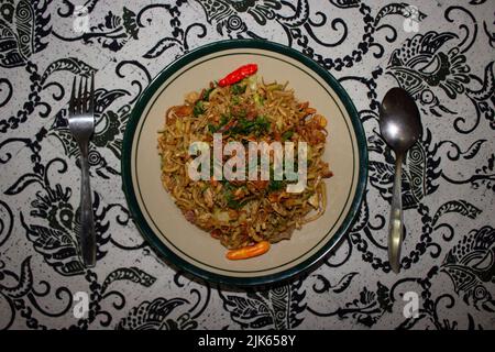 "Mie Goreng Jawa or bakmi jawa or java noodle with spoon and fork ...