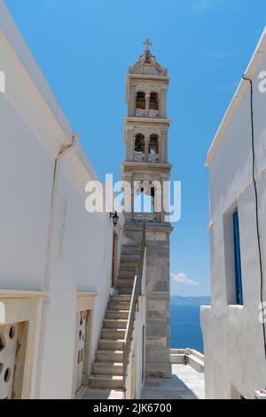 Greece, Tinos island, Cyclades. Arched stonewall entrance in front of ...