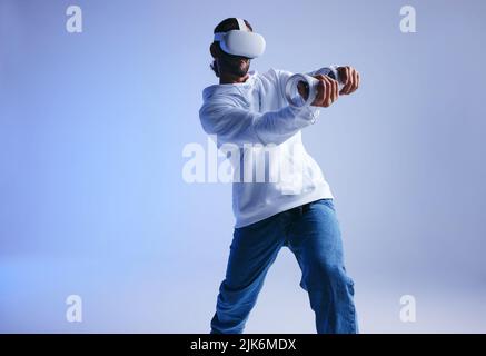 Cricket in virtual reality. sporty young man batting a virtual ball ...