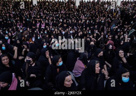 Barzan, Iraq. 31st July, 2022. An elderly Kurdish woman attends a ...