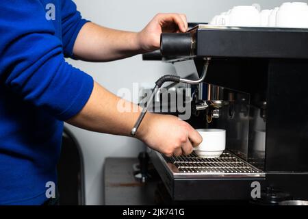 the process of making coffee. the guy makes coffee Stock Photo - Alamy