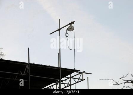 Pulley on scaffolding above new house construction to enable material ...
