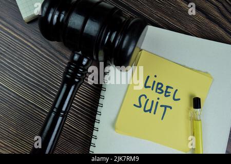 Concept of Defamation Law write on sticky notes with gavel isolated on ...