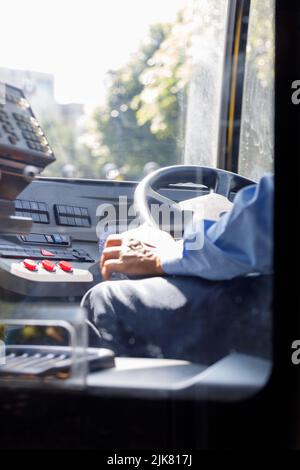 Modern bus interior with drivers hand Stock Photo - Alamy