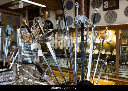 Collection of swords in souvenir shop Stock Photo - Alamy